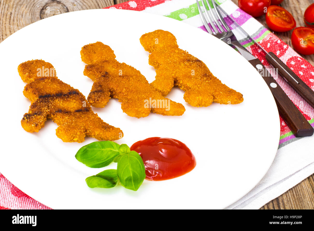 Fish nuggets for kids Dinosaurs Stock Photo - Alamy