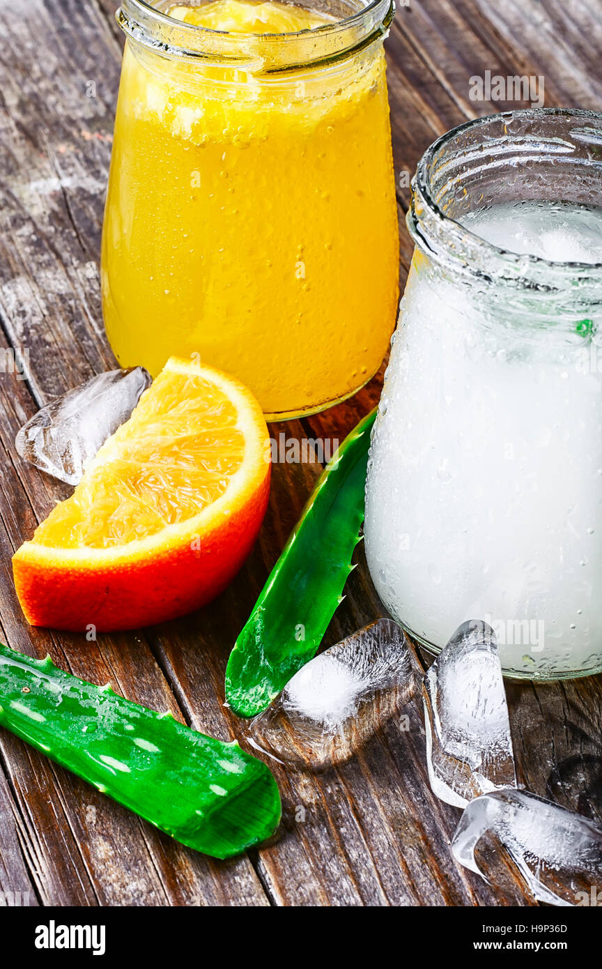 glass of medicinal drink sap from aloe leaf and orange Stock Photo - Alamy