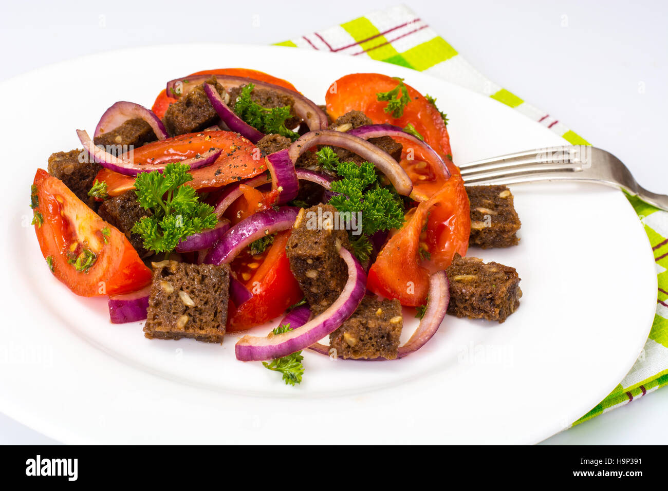 Simple salad with bread, tomato, red onion, vegetable oil. Studio Photo ...