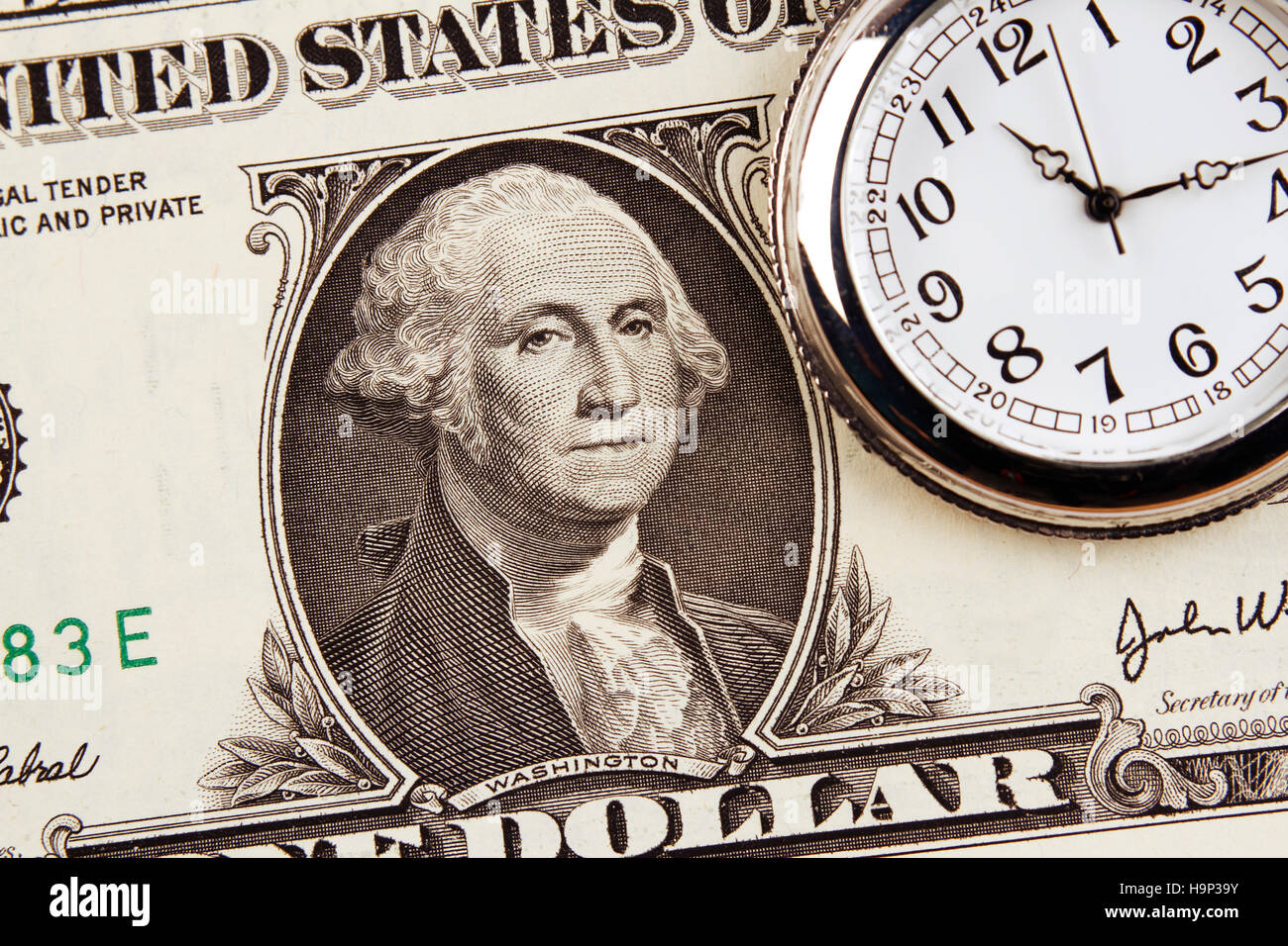Watch and cash. Time is money Stock Photo - Alamy