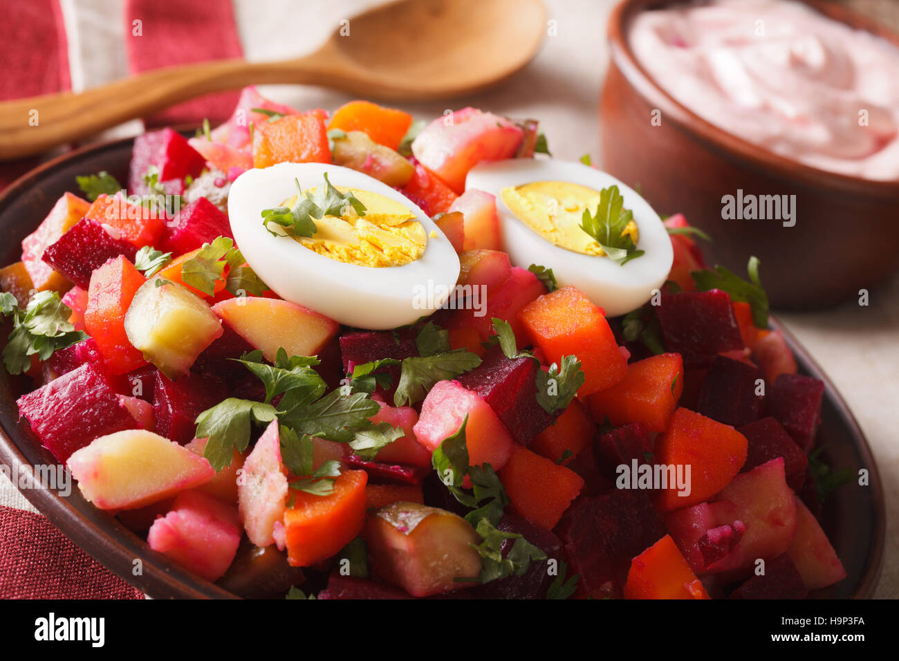 Finnish rosolli vegetable salad and sauce close-up on the table ...