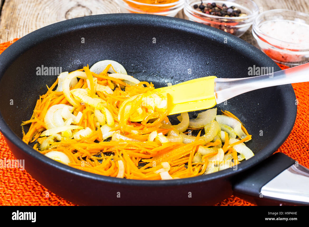 Roasted carrots and onions in a frying pan Stock Photo - Alamy
