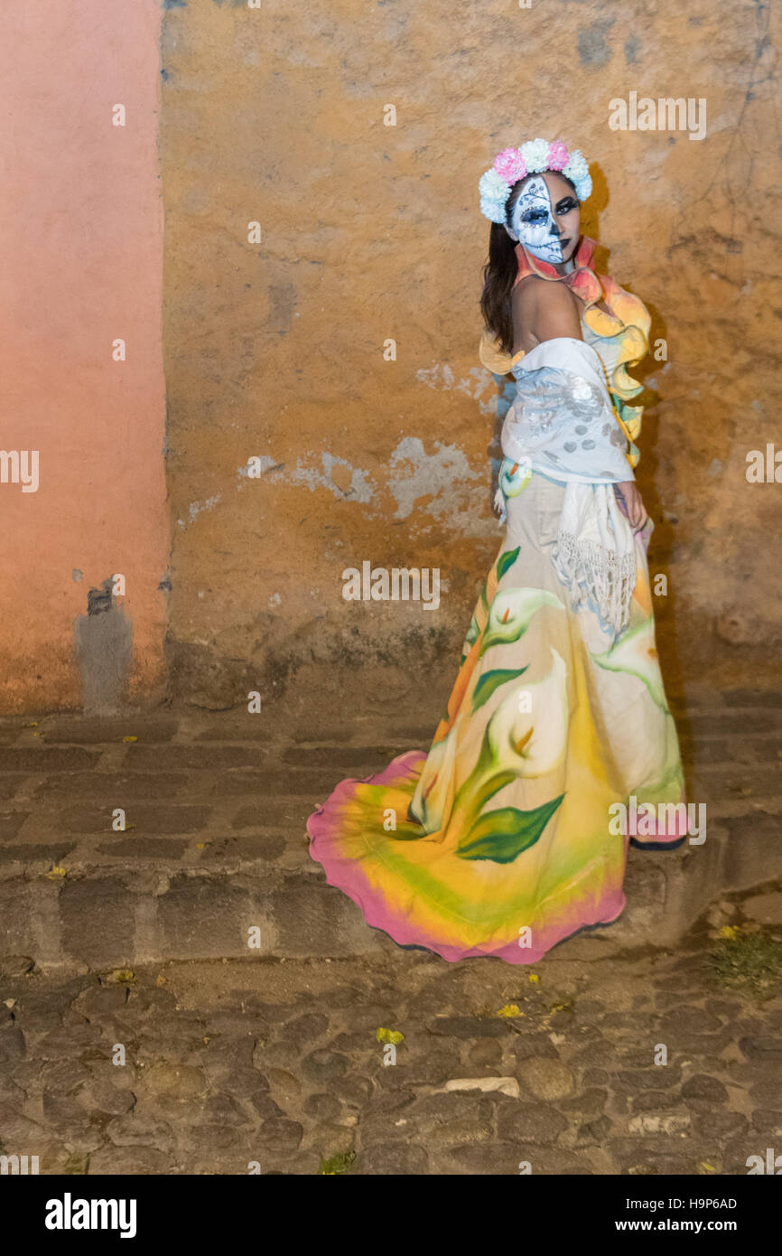 A woman dressed as La Calavera Catrina poses during the Day of the Dead ...