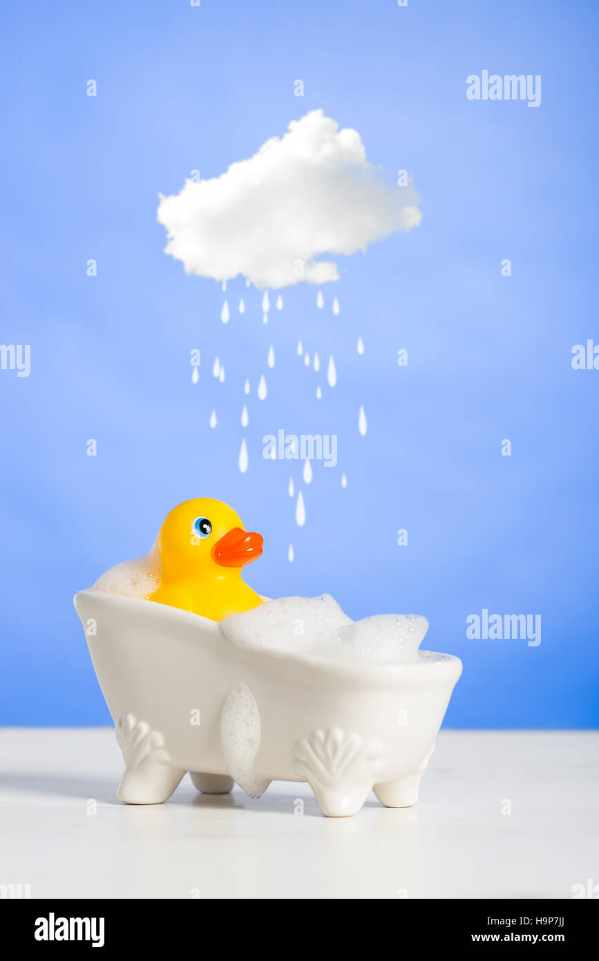 Rubber duck taking a bath with cloud over head Stock Photo - Alamy