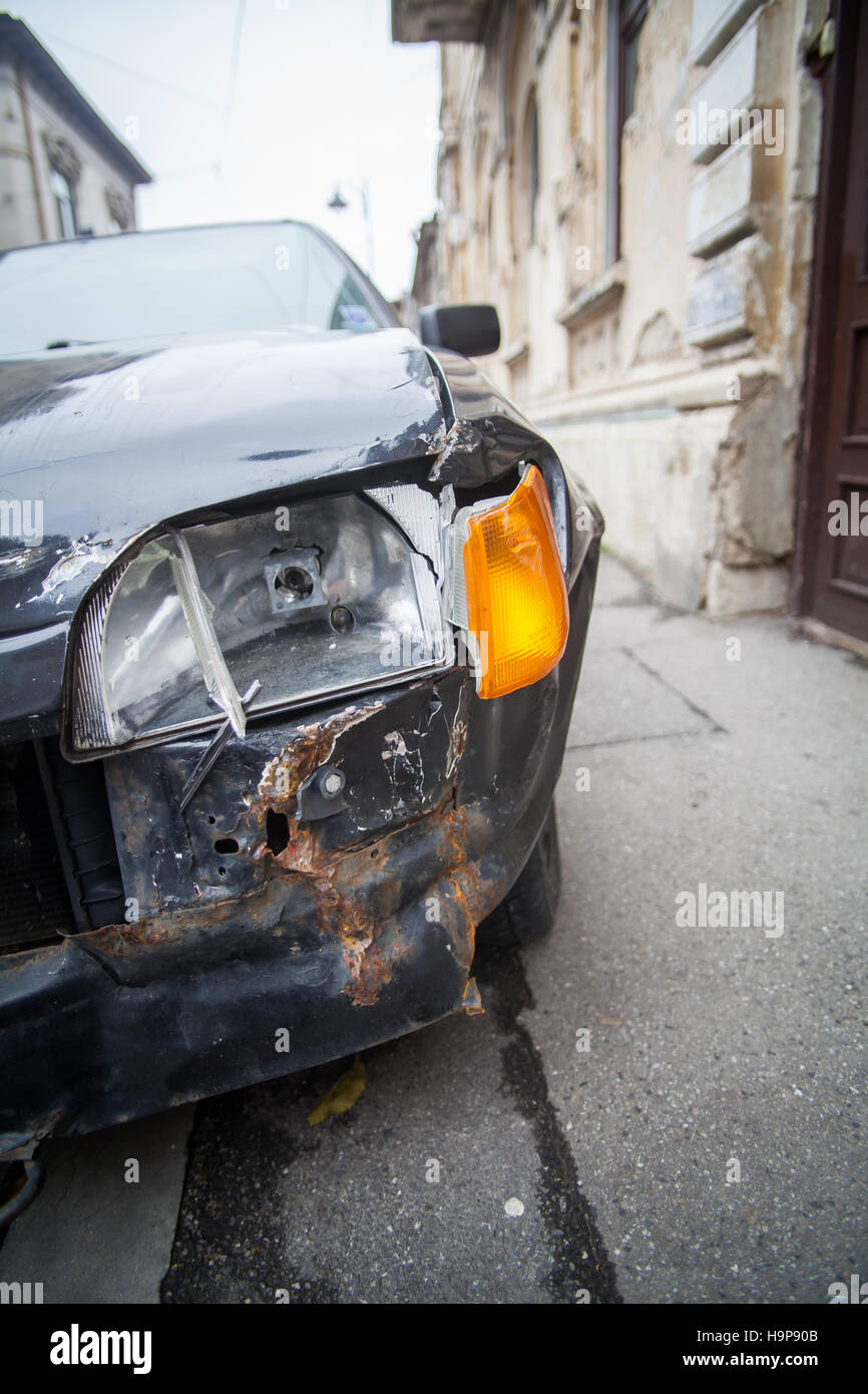 Color image of a crashed car with broken headlight Stock Photo - Alamy