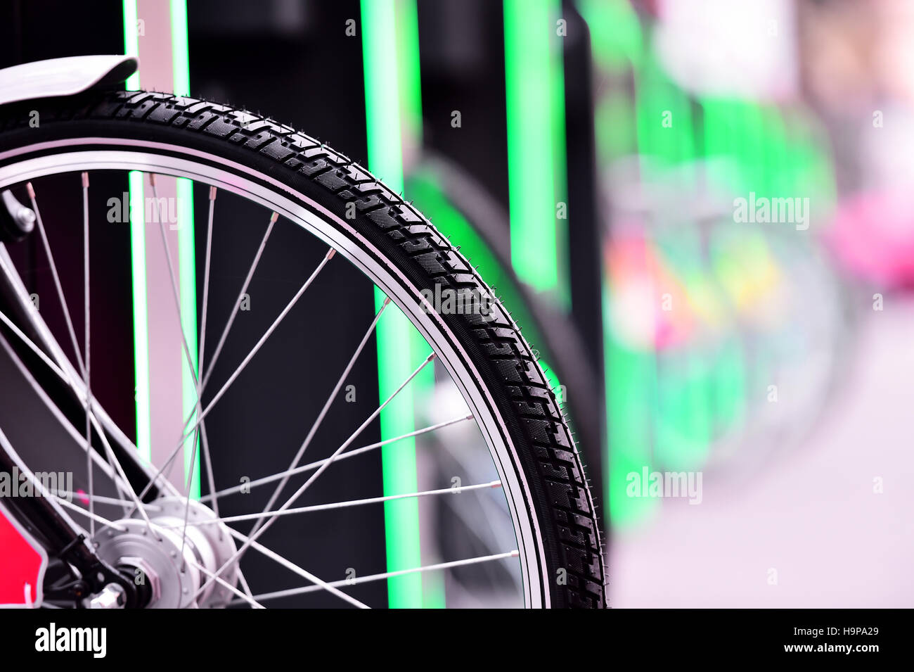 Urban bicycle sharing system wheel detail Stock Photo - Alamy