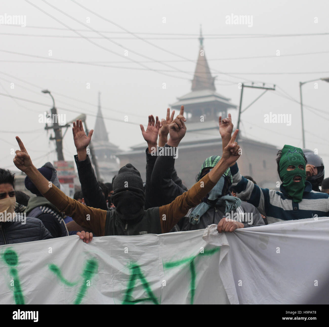 Srinagar, Kashmir. 25th Nov, 2016. Masked youth shouting pro-freedom ...