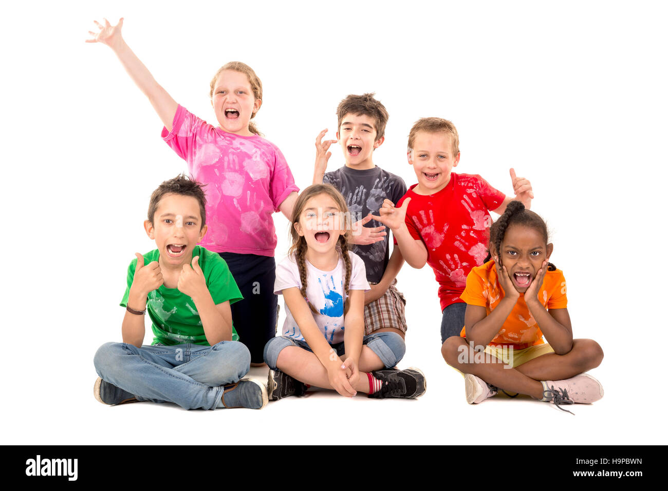 Group of happy children posing isolated in white Stock Photo - Alamy