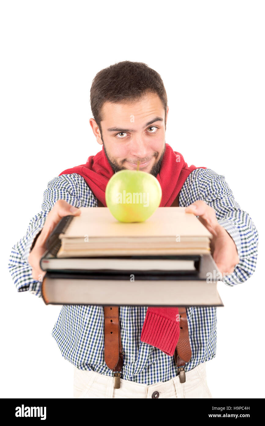 Young nerd student posing with books and apple isolated in a white ...