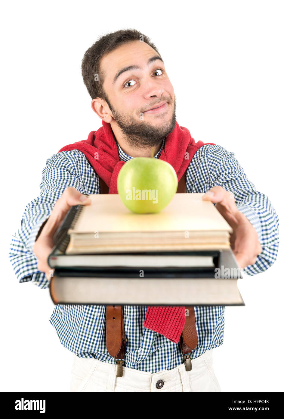 Young nerd student posing with books and apple isolated in a white ...
