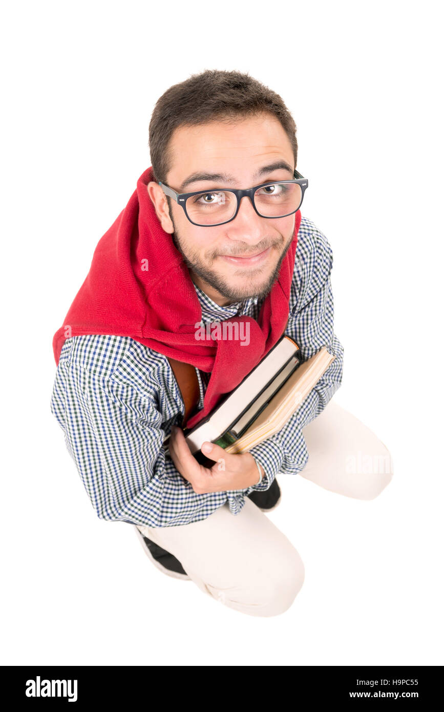 Young nerd student posing with books isolated in a white background ...
