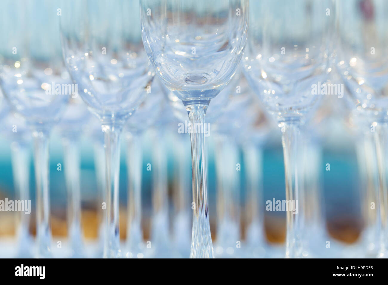 Empty wine glasses setting for wedding party Stock Photo - Alamy