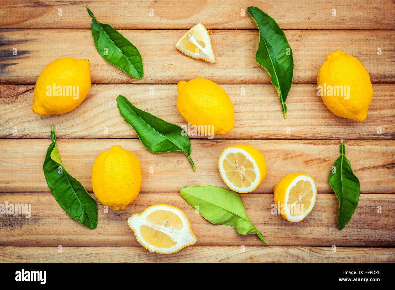 Fresh lemons and lemons leaves on rustic wooden background. Fre Stock ...