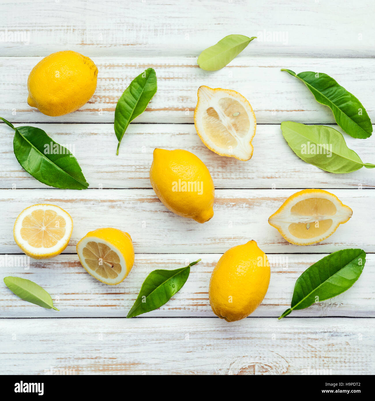 Fresh lemons and lemons leaves on rustic wooden background. Fre Stock ...