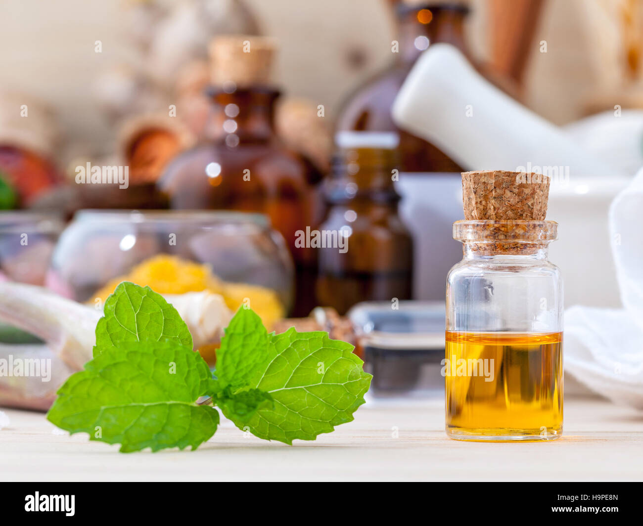 Fresh green mint and essential oil with shallow depth of field s Stock ...
