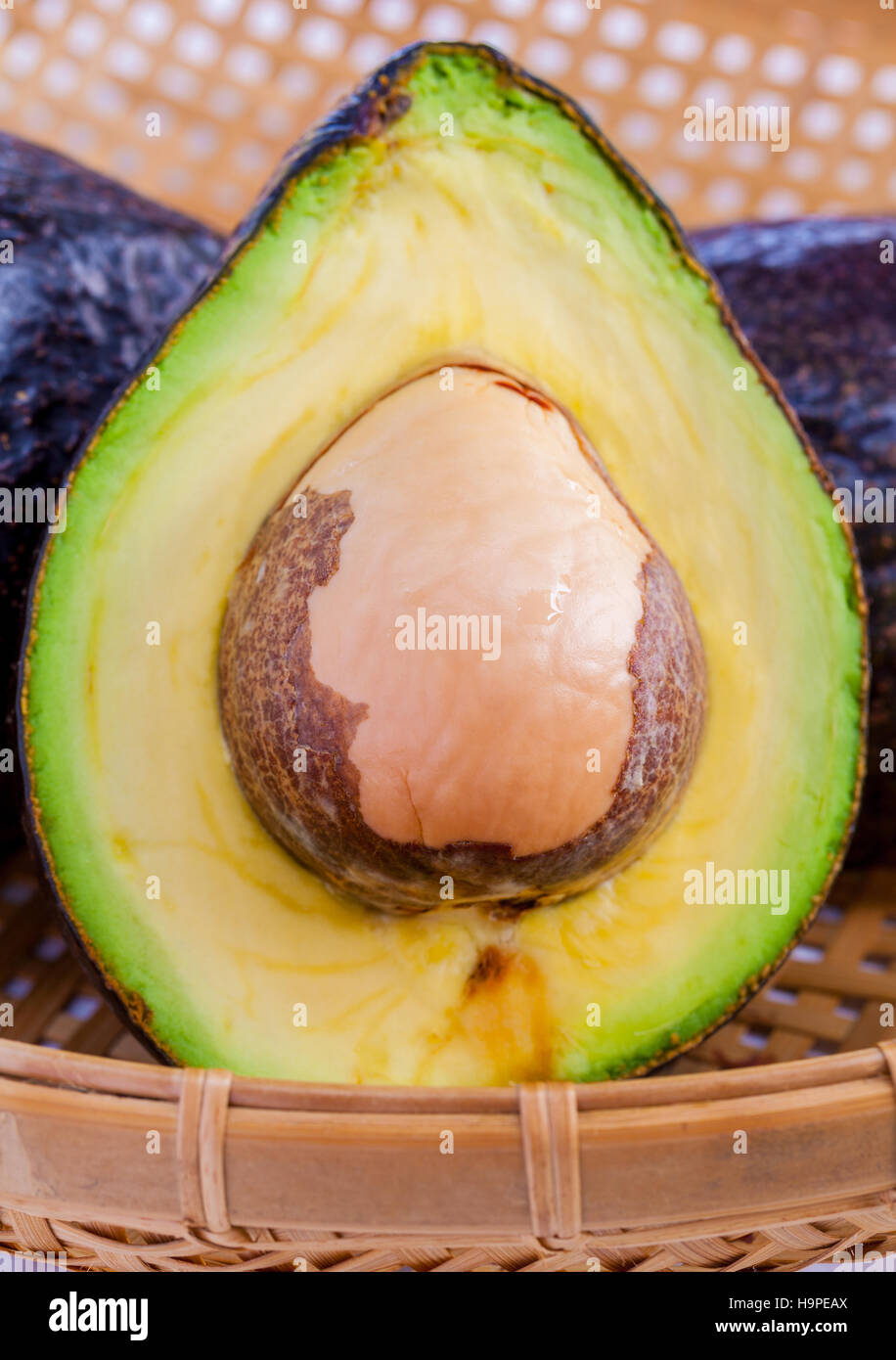 Halved avocado with core isolated on white - in macro shot Stock Photo ...