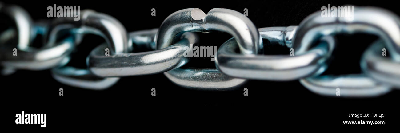 closeup of shiny steel chain links with weak link Stock Photo - Alamy