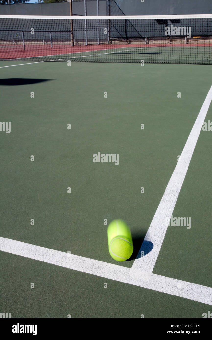 tennis ball motion on court with net Stock Photo - Alamy