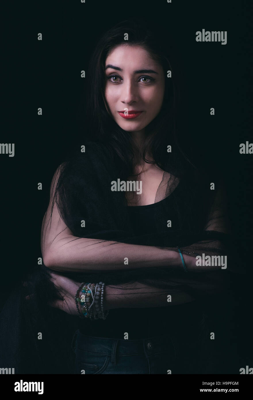 Portrait of beautiful woman on dark background Stock Photo - Alamy