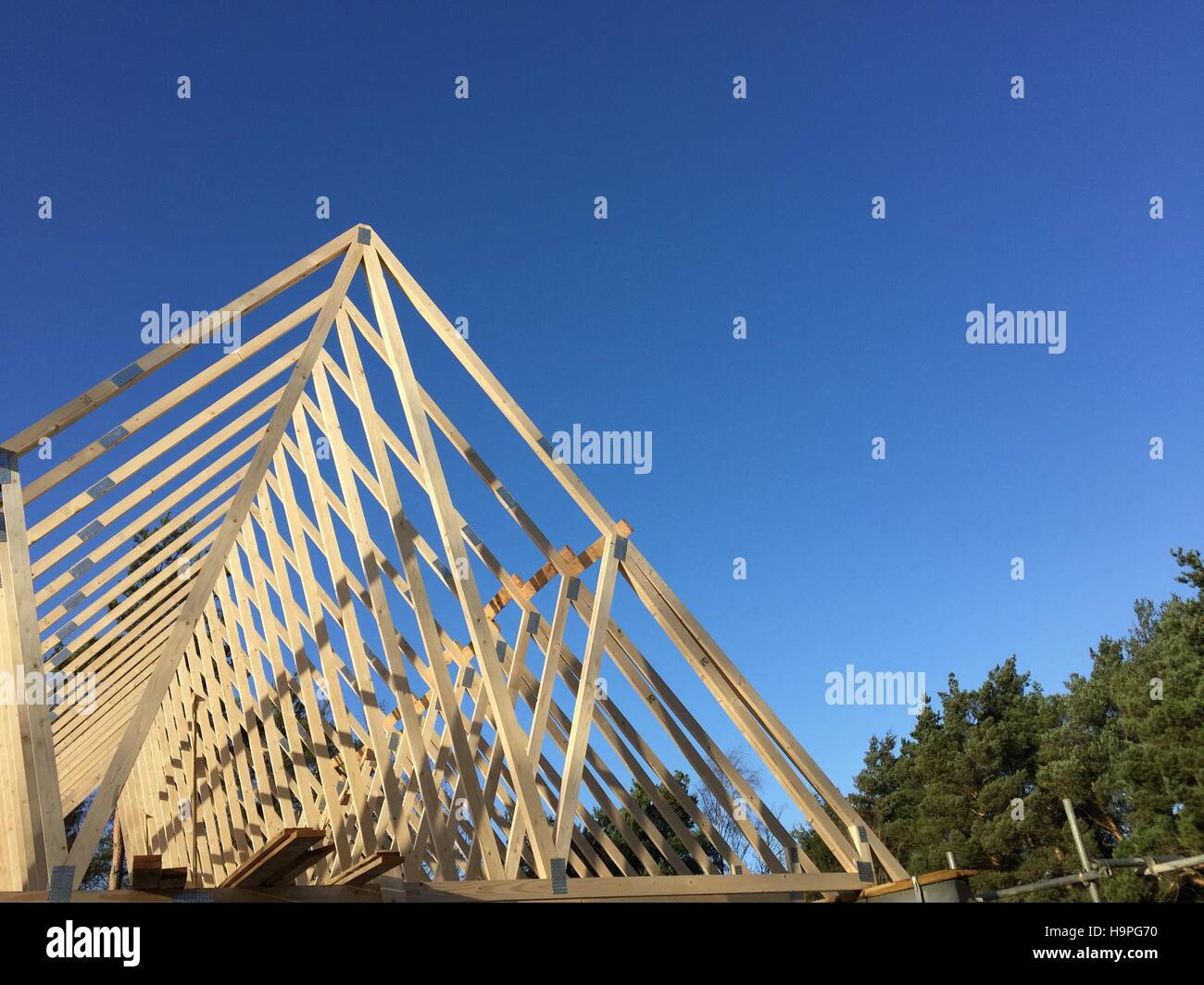 Low angle view of a new build roof under construction, installation and ...