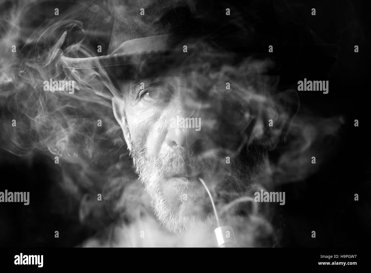 Portrait of man with pipe,monochrome and low key technique Stock Photo ...