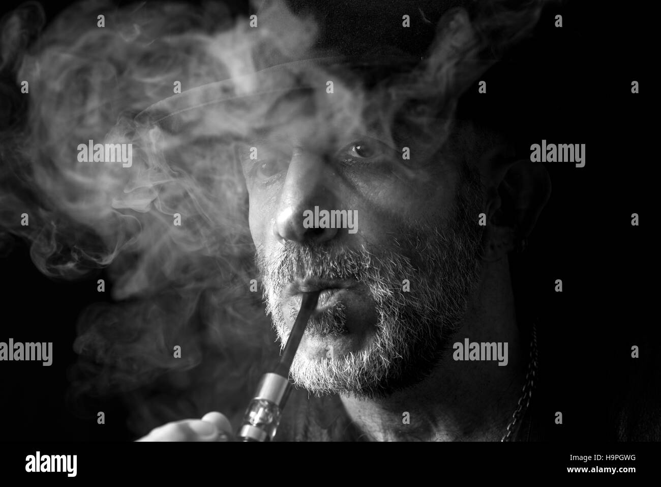 Man in the smoke,low key technique and monochrome Stock Photo - Alamy