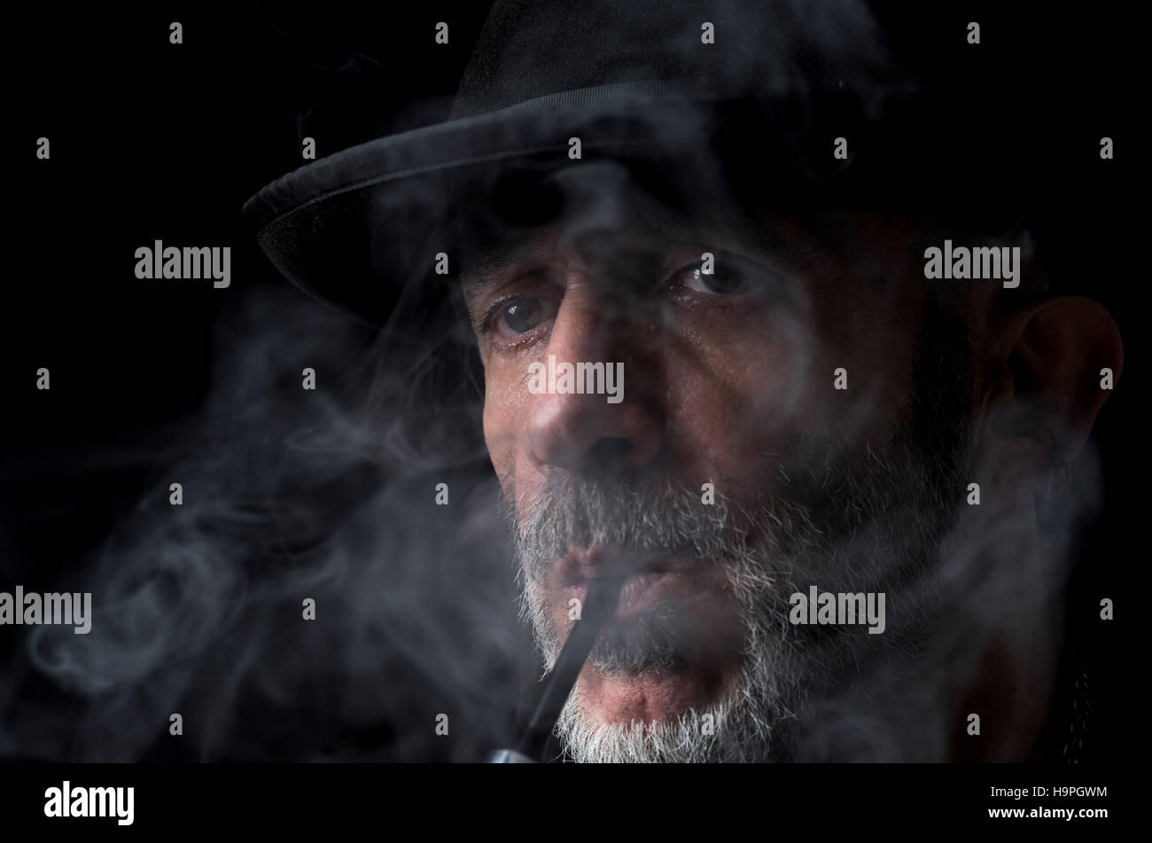 Man portrait in the smoke Stock Photo - Alamy