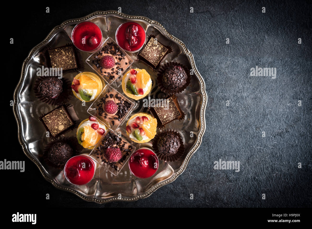Assorted of chocolate and fruit mini cakes for holiday,empty space ...