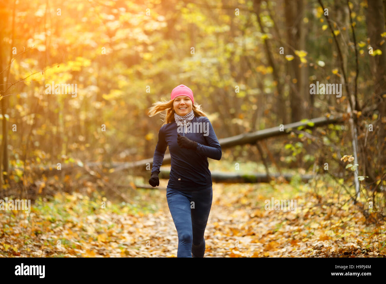 Blonde woman running in morning Stock Photo - Alamy