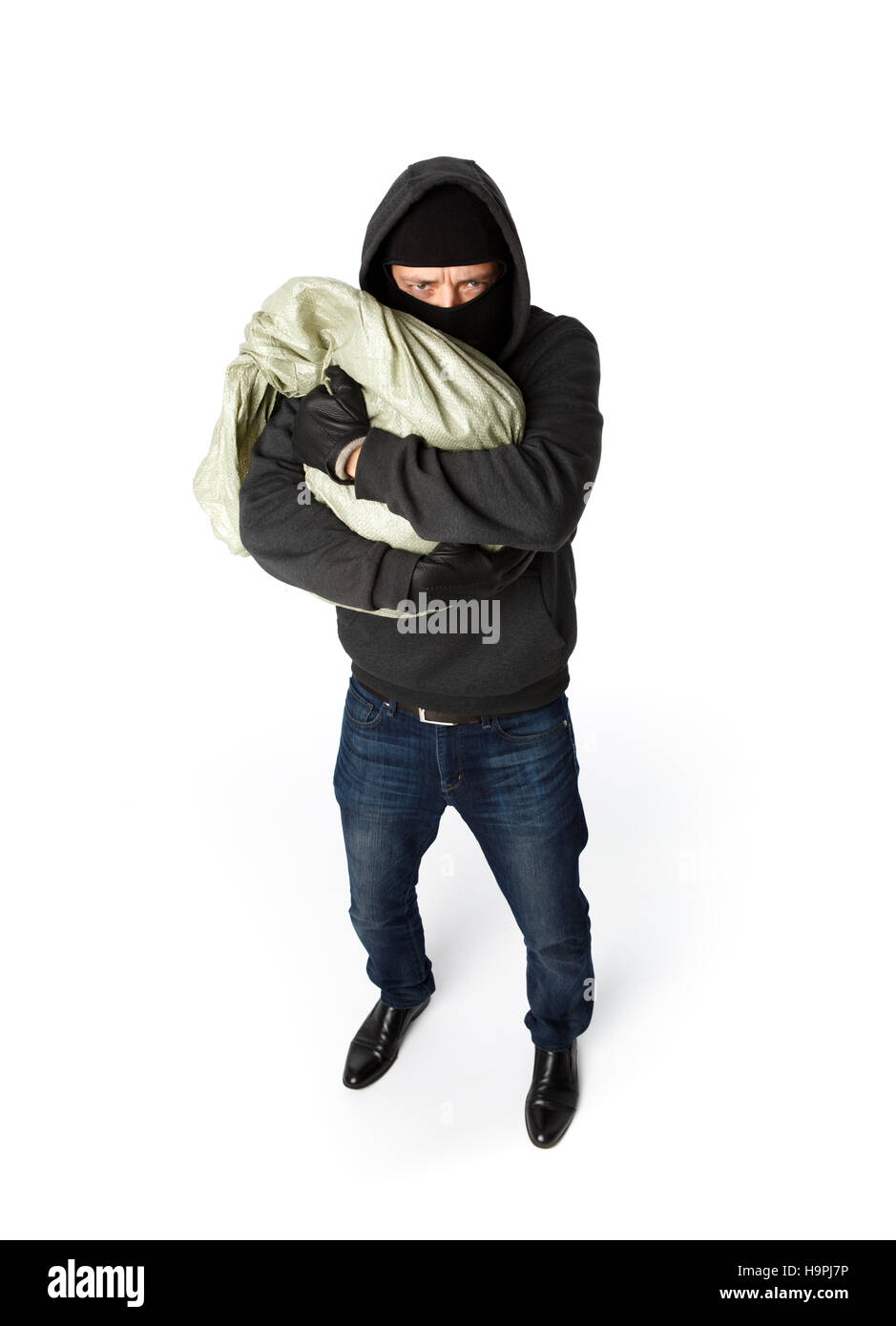 Terrible robber hugging big sack Stock Photo - Alamy