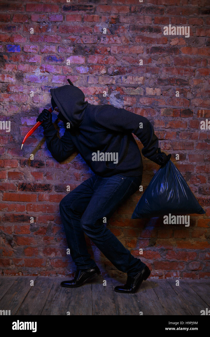 Robber with bag ,lock pick Stock Photo - Alamy