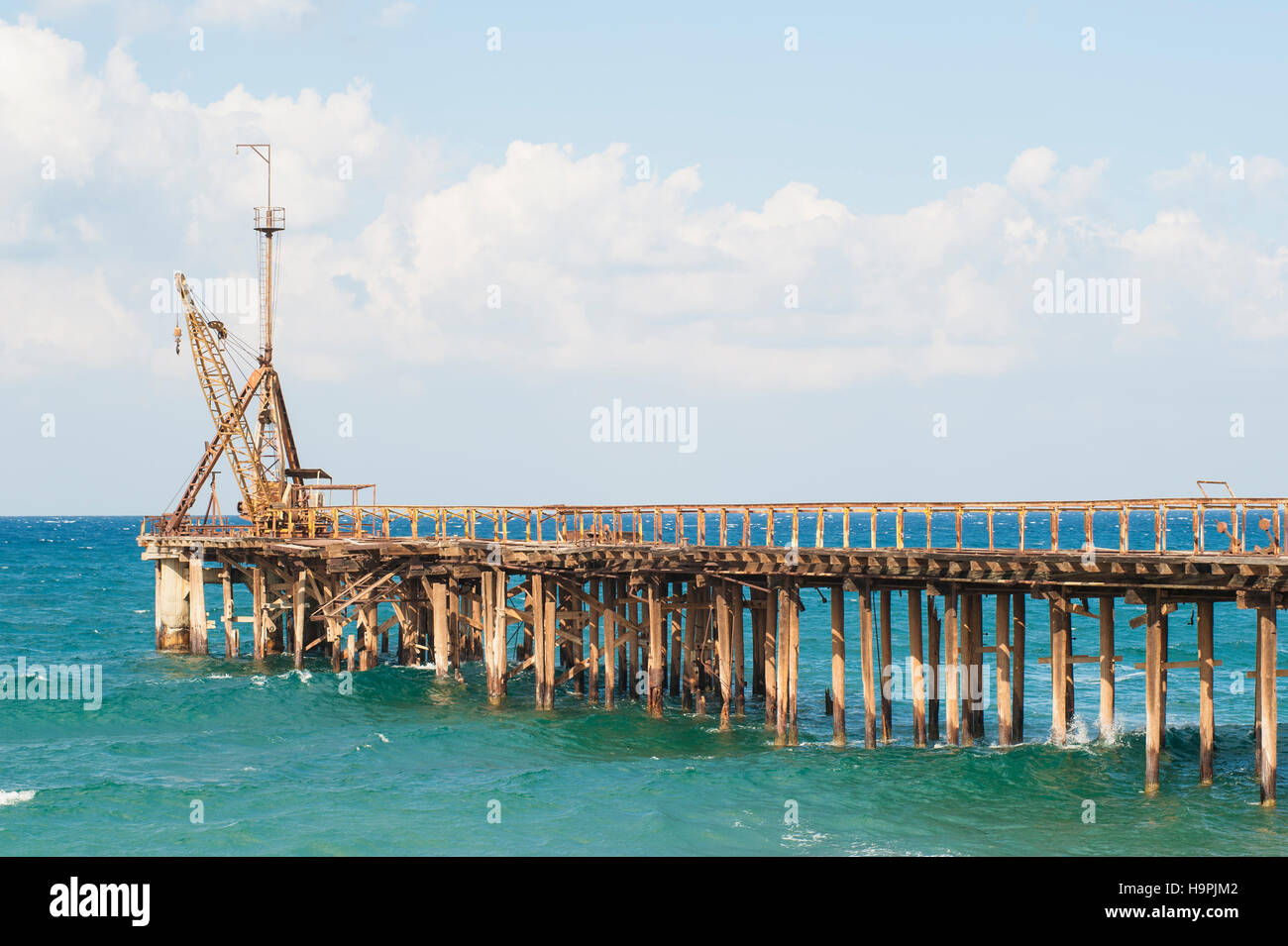 A defunct pier on the shore of Northern Cyprus in Lefka (Turkish: Lefke ...