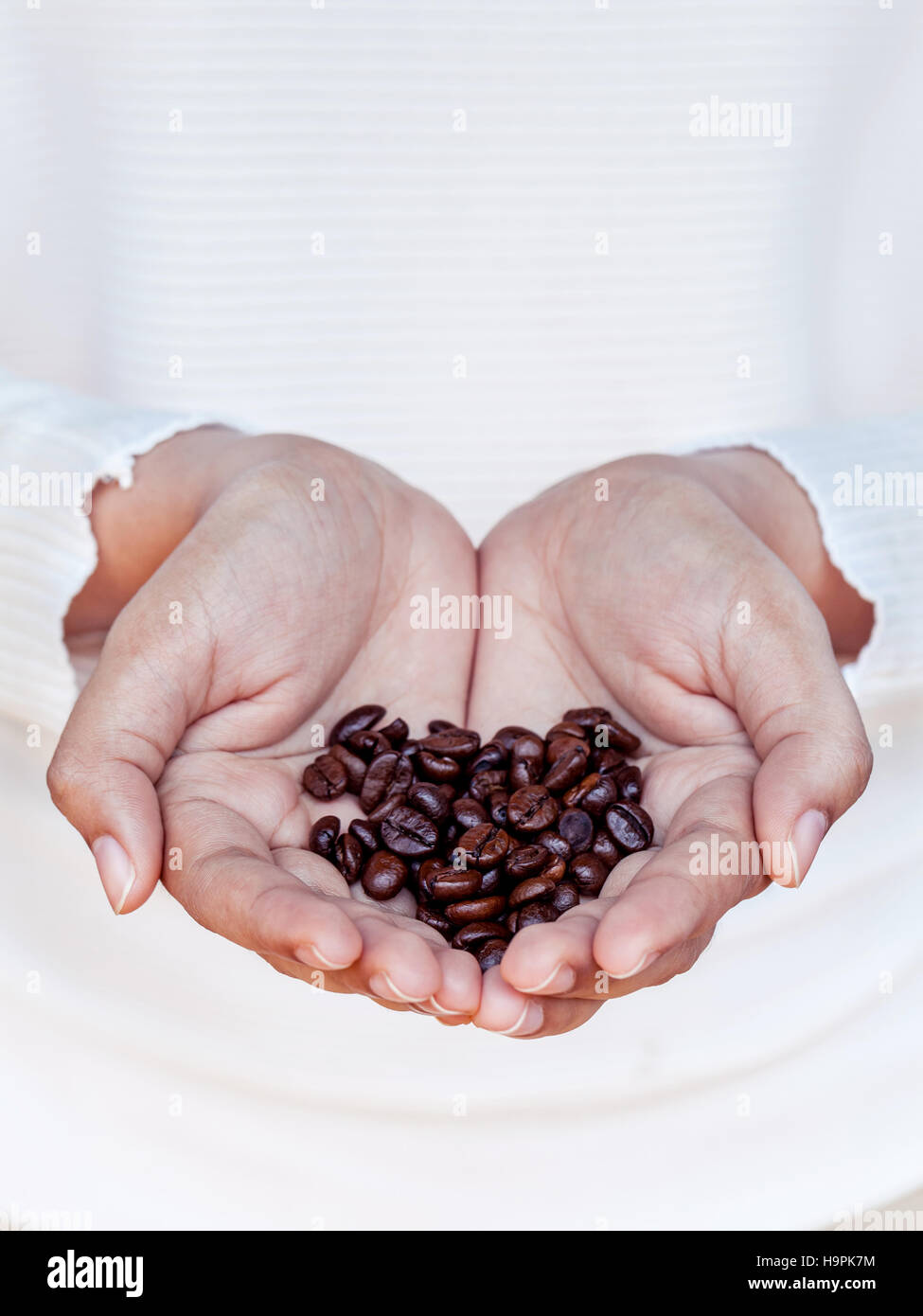 Hand of women holding coffee beans . - Concept for giving refres Stock ...