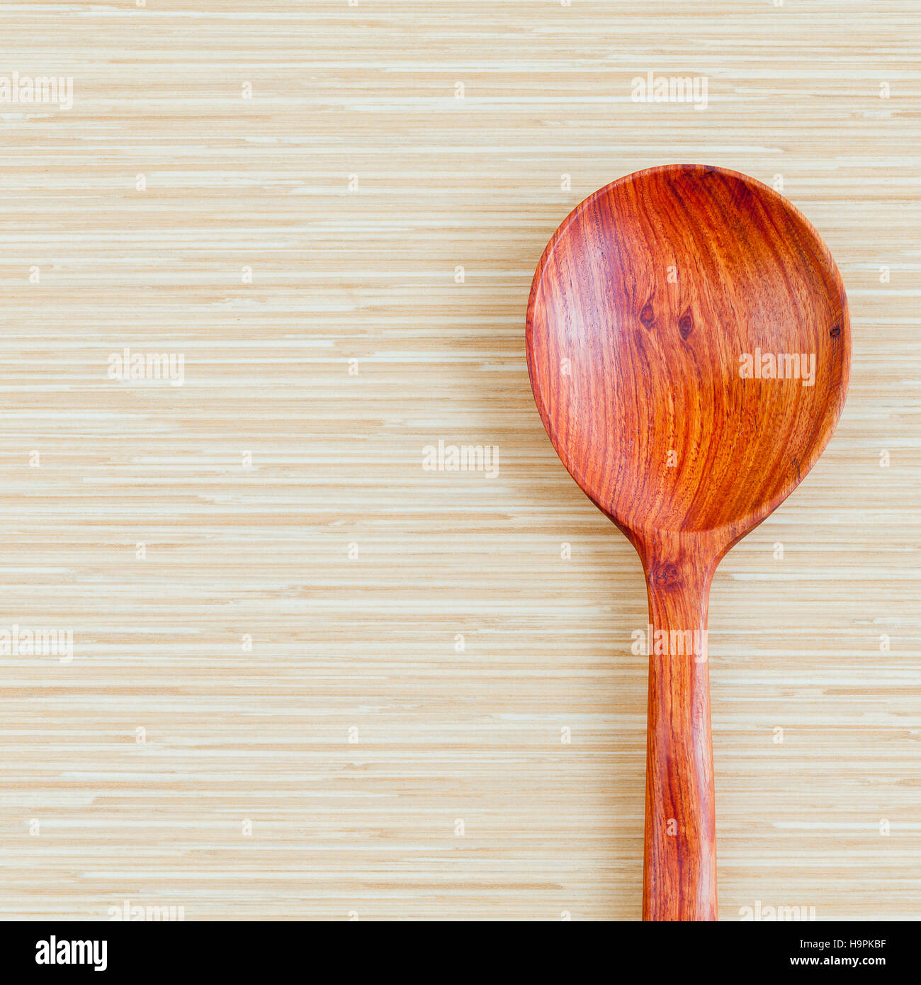 Wooden spoon on wooden background - concept for food and kitchen Stock ...