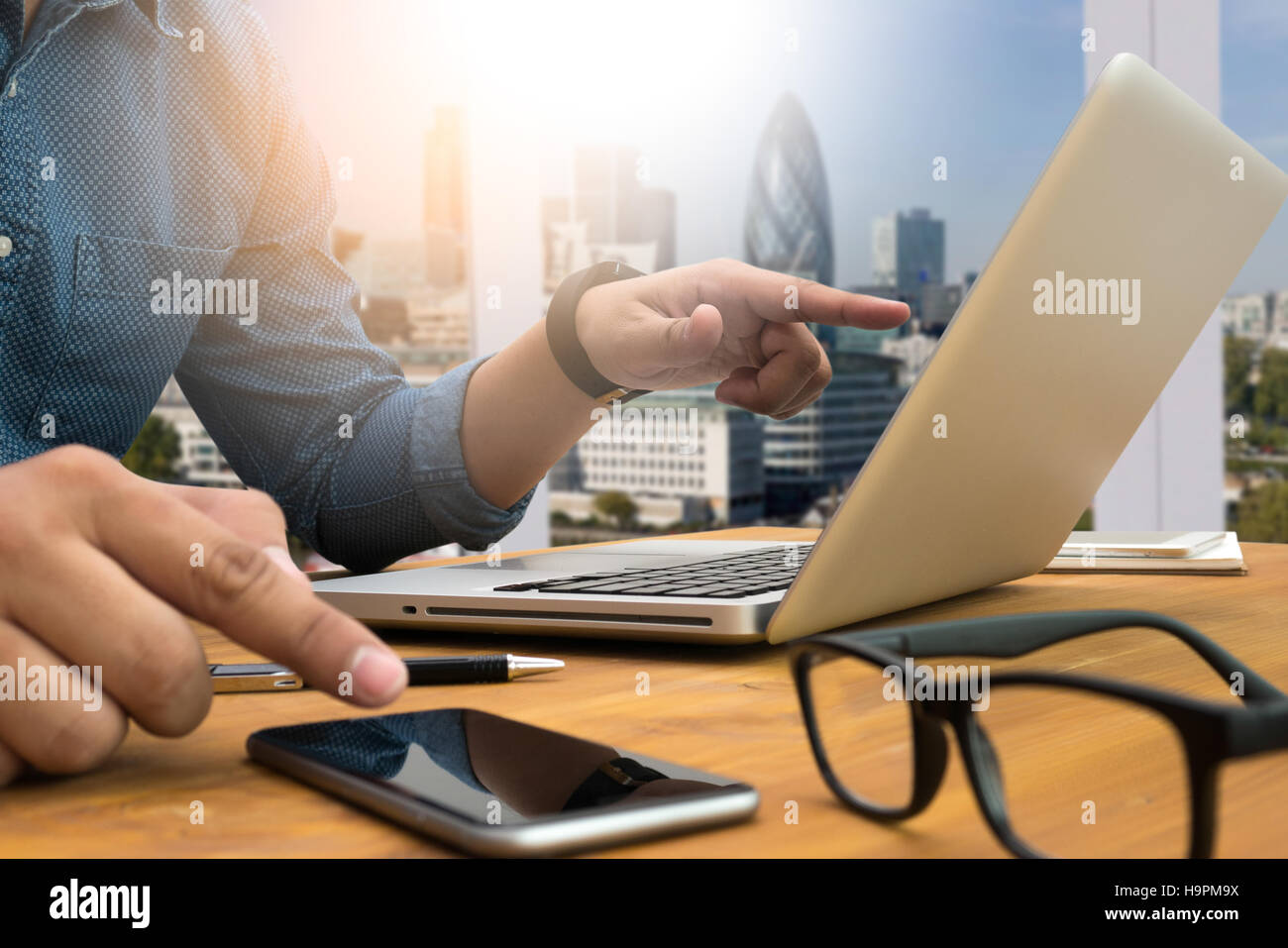 Cropped shot Silhouette of a man's hands using a laptop , young Stock ...