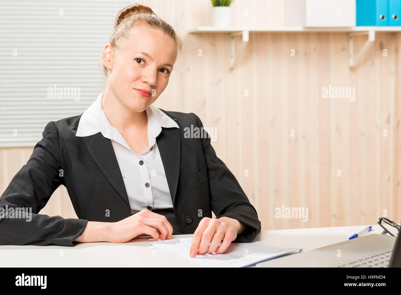 handsome accountant in a jacket at office working Stock Photo - Alamy
