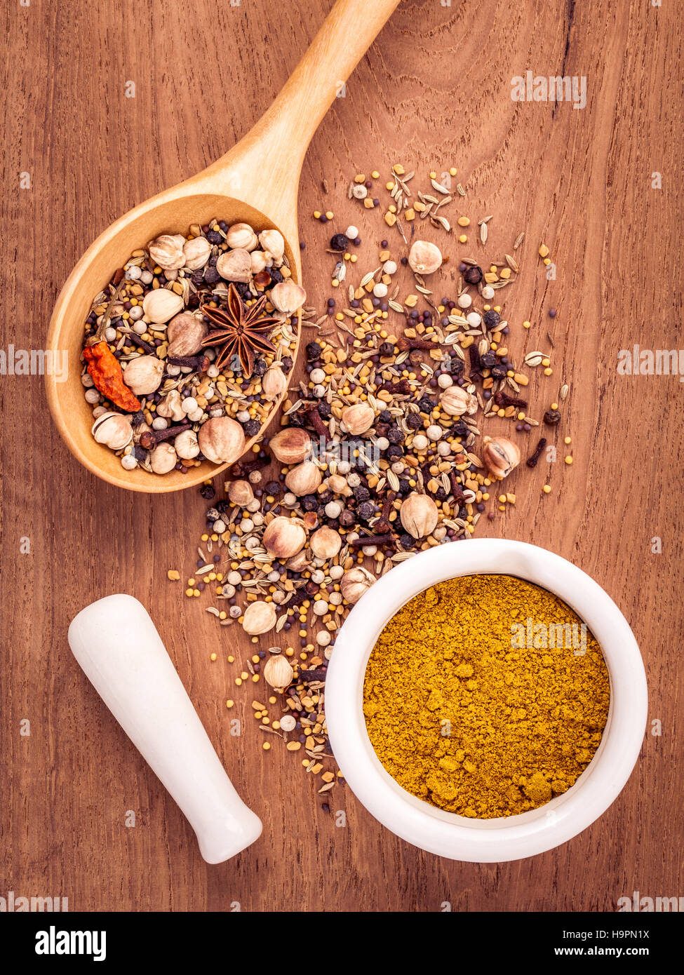 Assorted of spices in wooden spoon black pepper ,white pepper Stock ...