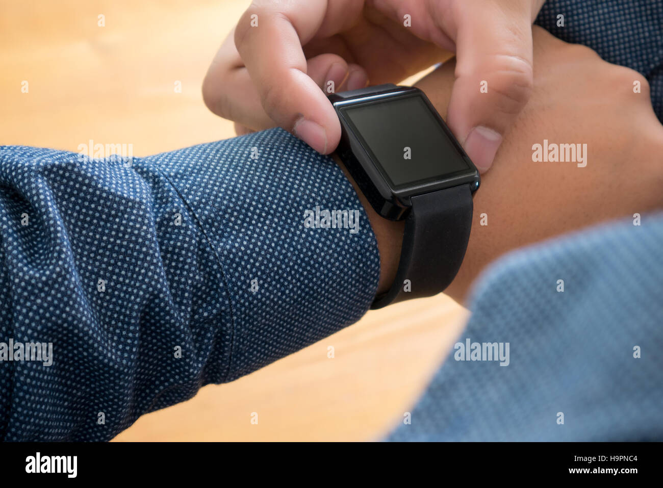 man checking his smartwatch Stock Photo - Alamy