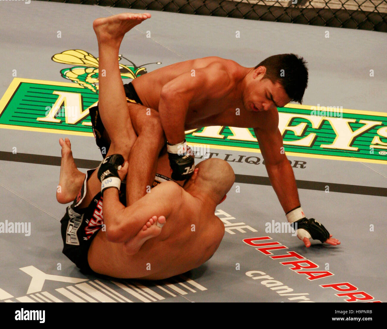 Lyoto Machida, top, fights Sam Hoger at the Ultimate Fighting Champion ...