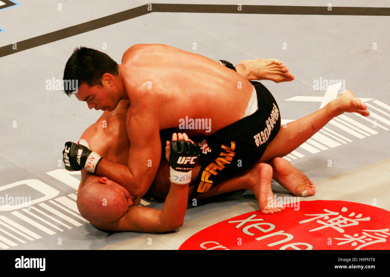 Lyoto Machida, top, fights Sam Hoger at the Ultimate Fighting Champion ...