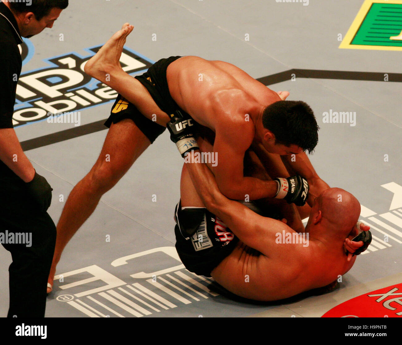 Lyoto Machida, top, fights Sam Hoger at the Ultimate Fighting Champion ...