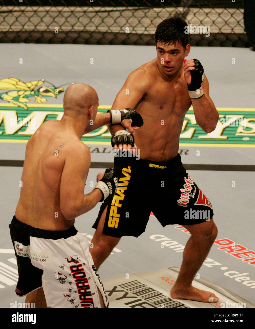 Lyoto Machida, right, fights Sam Hoger at the Ultimate Fighting ...