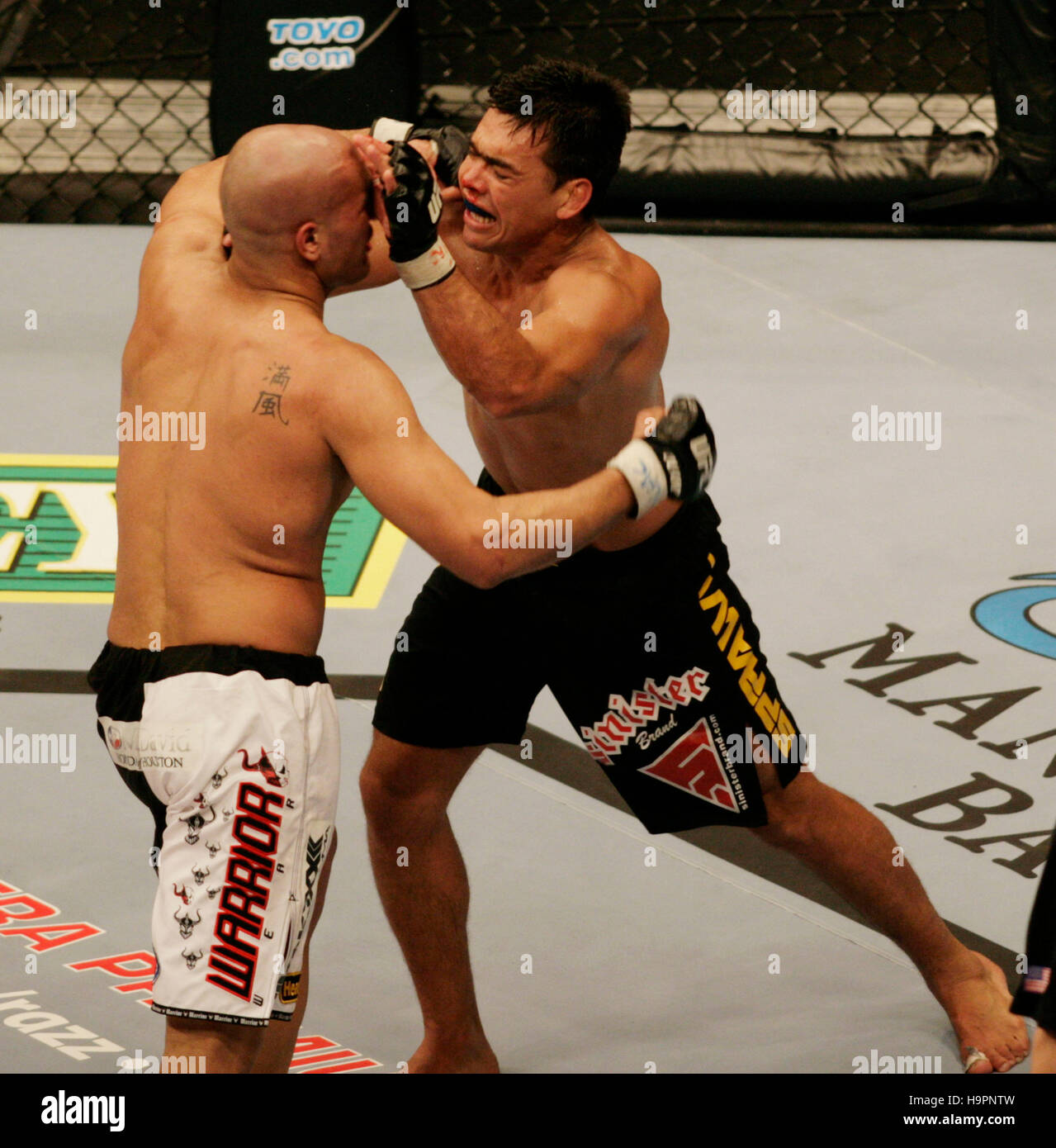 Lyoto Machida, right, fights Sam Hoger at the Ultimate Fighting ...