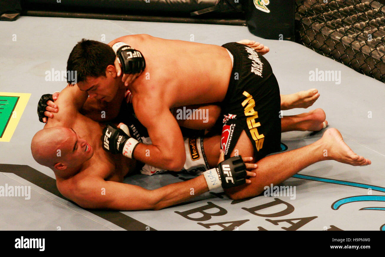 Lyoto Machida, top, fights Sam Hoger at the Ultimate Fighting Champion ...