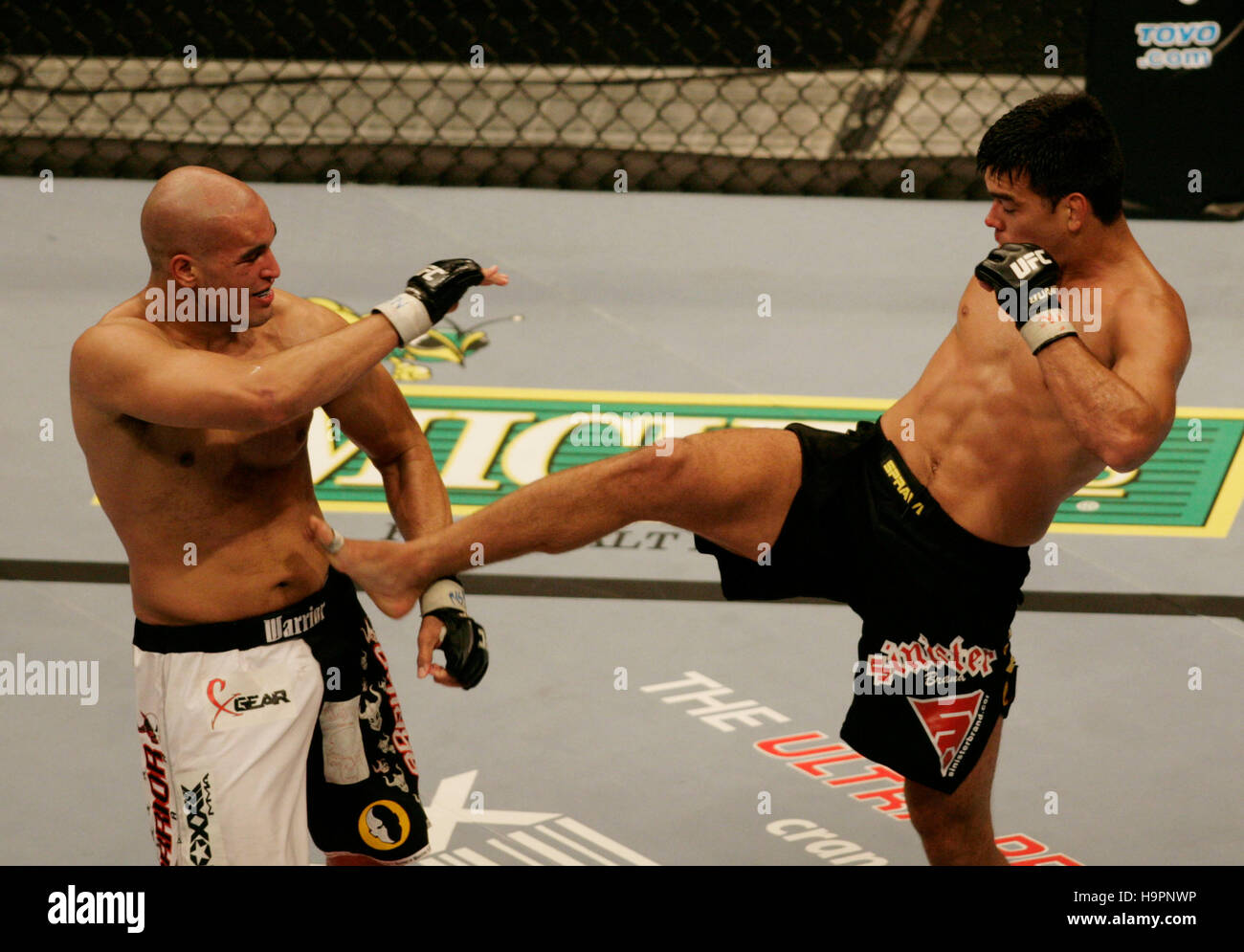 Lyoto Machida, right, fights Sam Hoger at the Ultimate Fighting ...