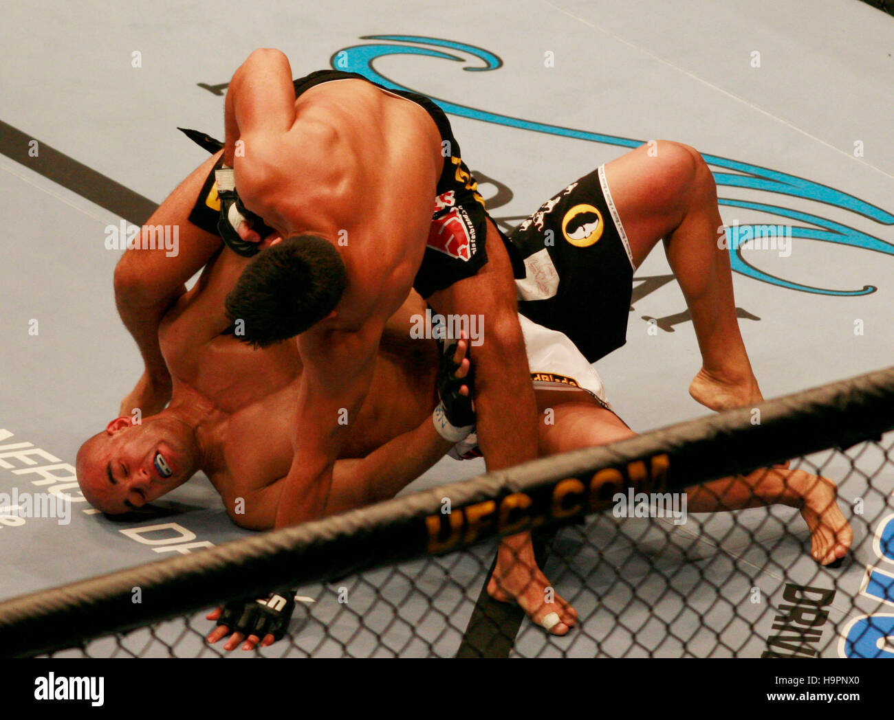 Lyoto Machida, top, fights Sam Hoger at the Ultimate Fighting Champion ...