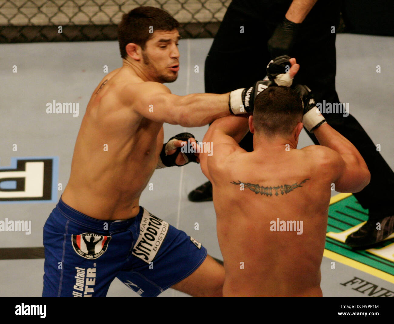 Patrick Cote, left, fights Scott Smith at the Ultimate Fighting ...
