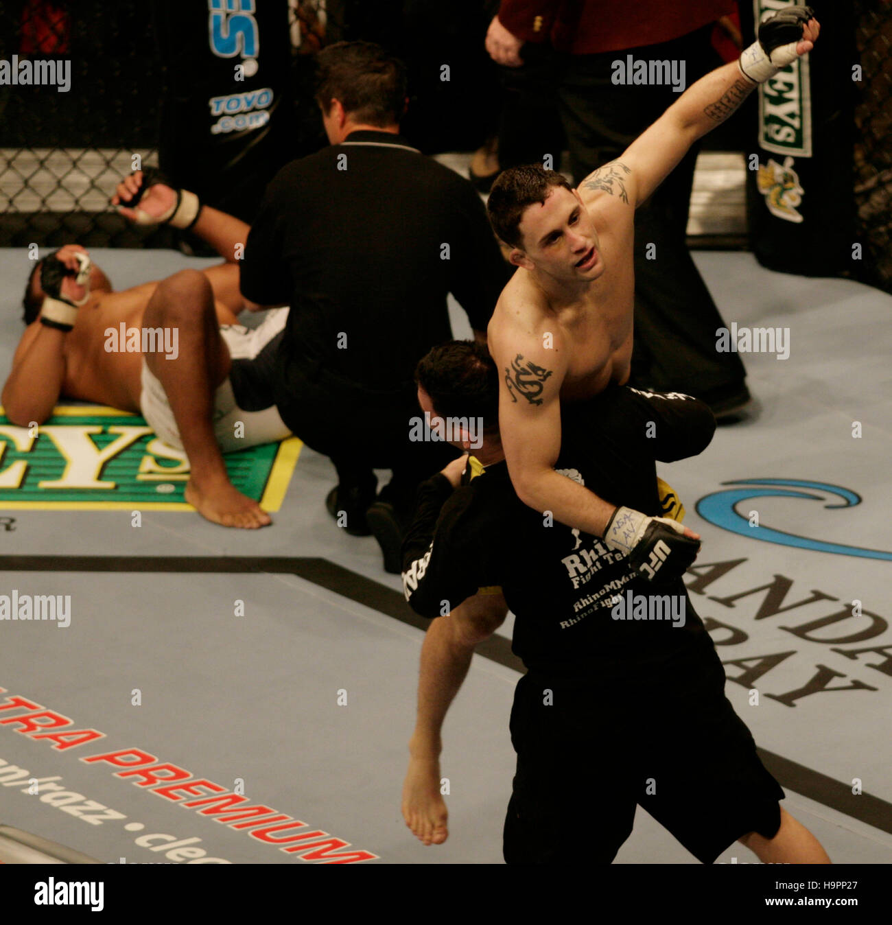 Frank Edgar celebrates his victory over Tyson Griffin at the Ultimate ...