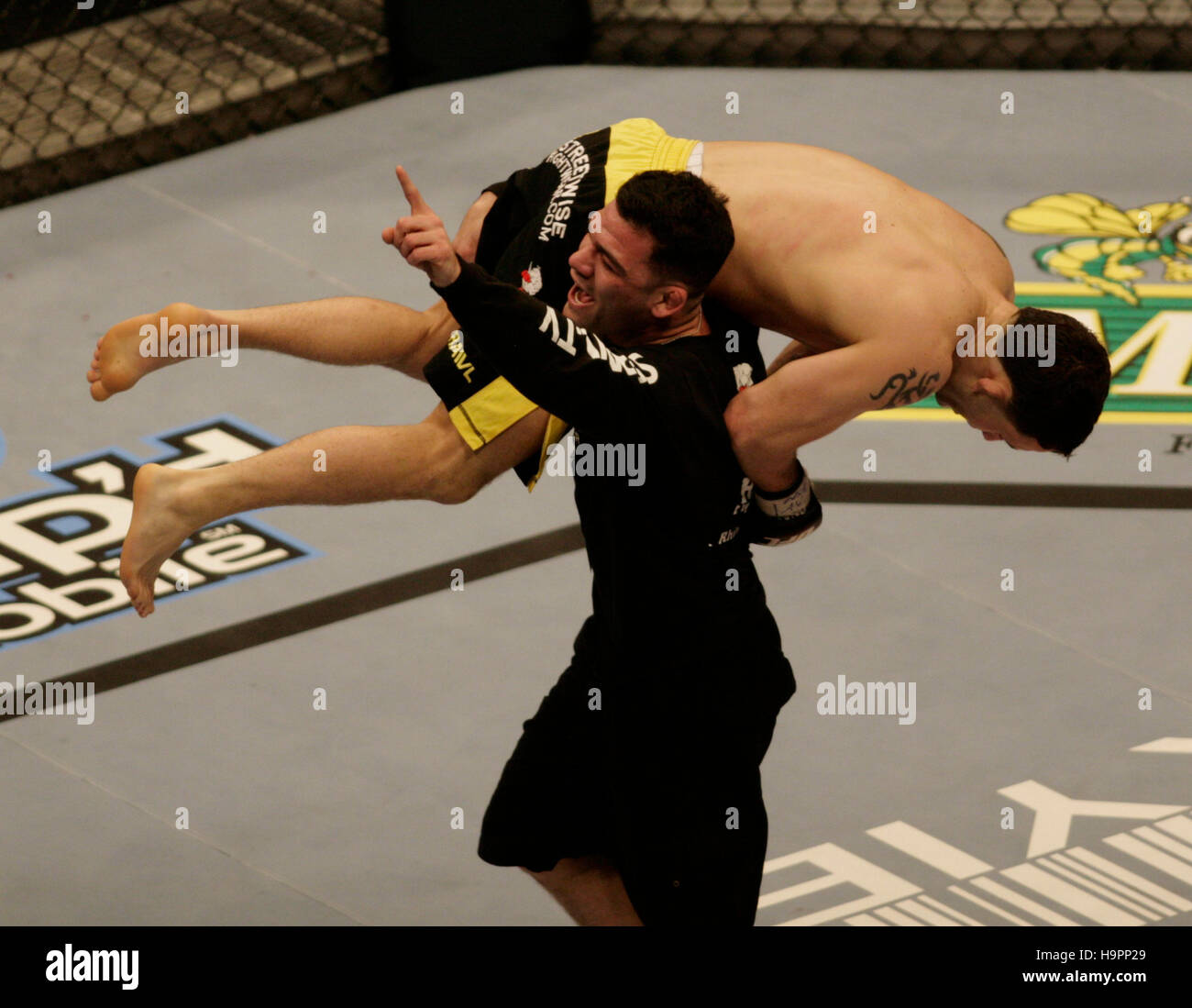 Frank Edgar celebrates his victory over Tyson Griffin at the Ultimate ...