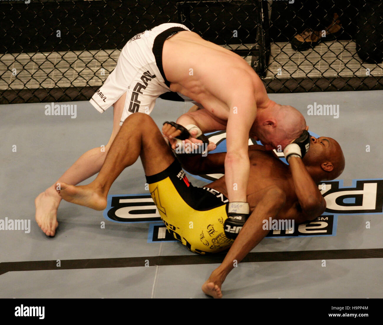Anderson Silva, bottom, fights Travis Lutter at the Ultimate Fighting ...